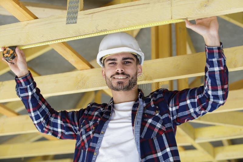 Happy Male Carpenter Working on Beams Stock Photo - Image of production ...