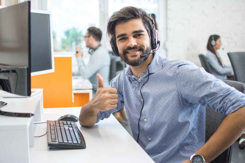 Happy Male Customer Service Operator Showing Thumb Up in Office. Stock ...