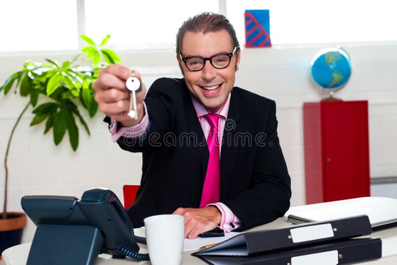 Happy Male Executive Handing Over the Keys Stock Photo - Image of ...
