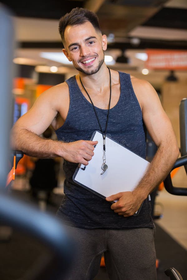 Happy Male Gym Instructor Looking at Camera Stock Photo - Image of ...