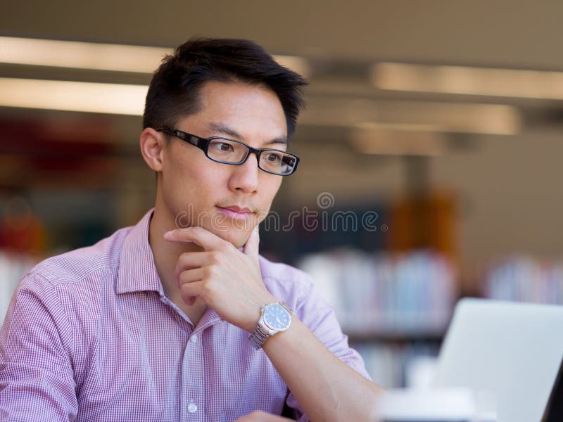 Happy Male Student Working at the Library Stock Image - Image of ...