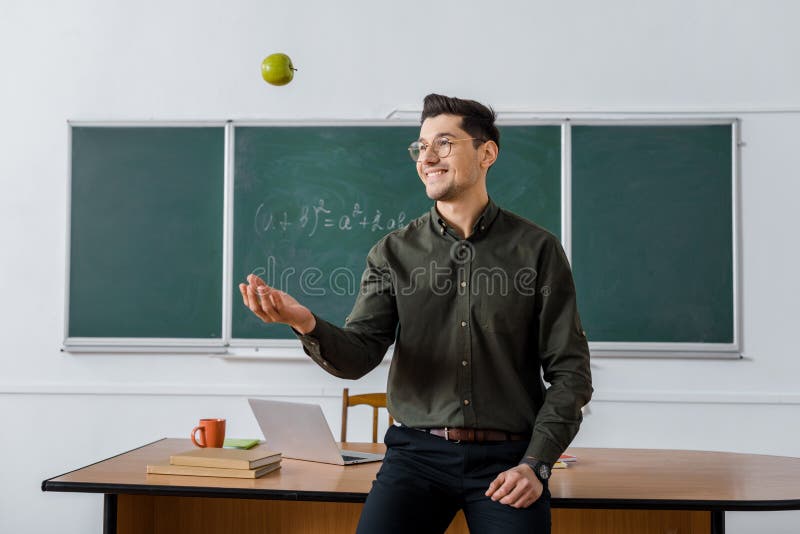 Happy Male Teacher Throwing Apple Stock Photo - Image of connection ...