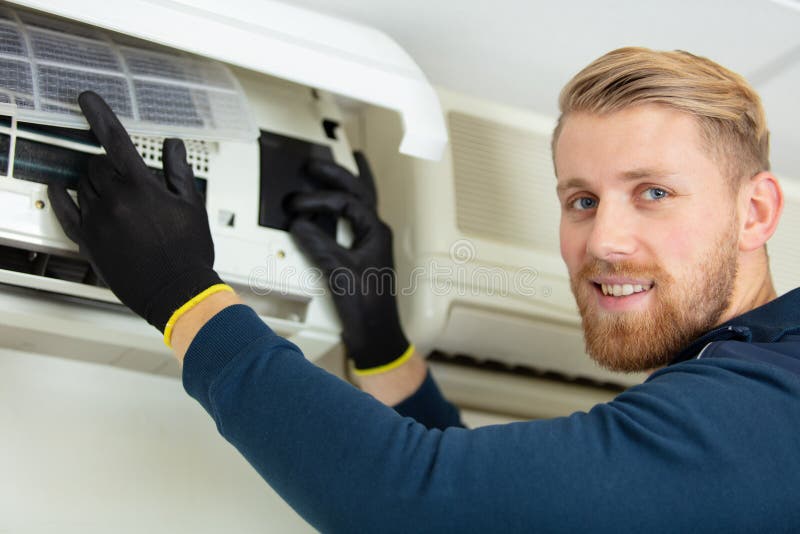 Happy Male Technician Repairing Air Conditioner Stock Photo - Image of ...