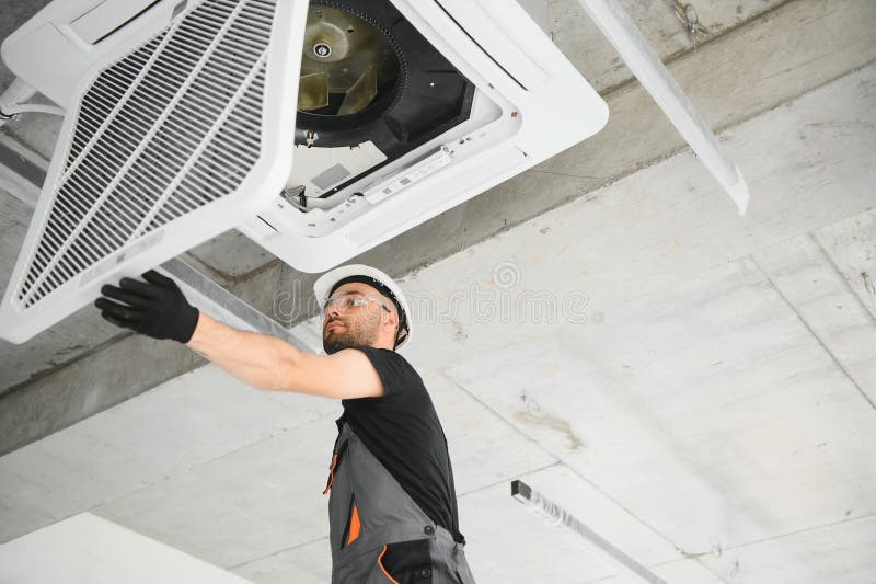 Happy Male Technician Repairing Air Conditioner Stock Image - Image of ...