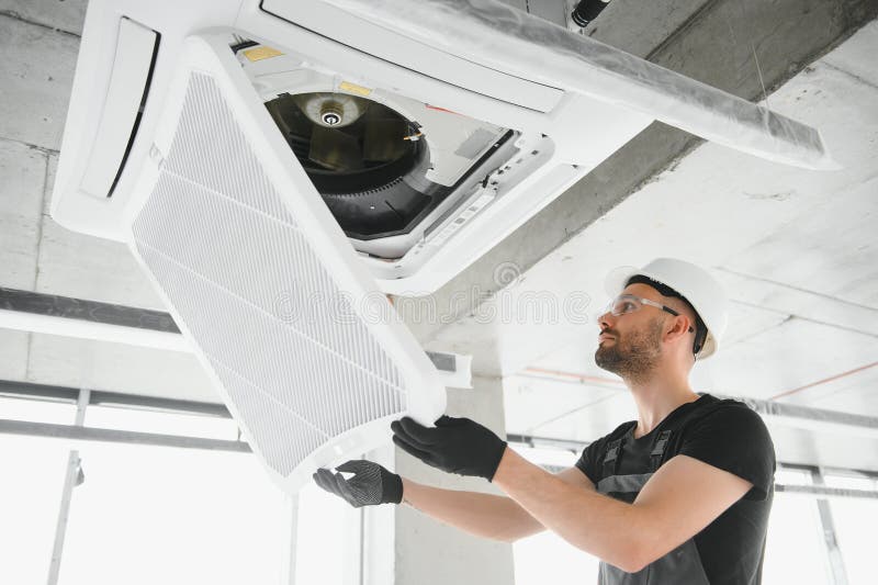 Happy Male Technician Repairing Air Conditioner Stock Photo - Image of ...