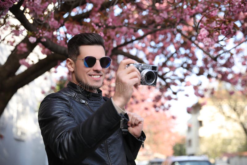 Happy Male Tourist with Camera on Spring Day Stock Photo - Image of ...