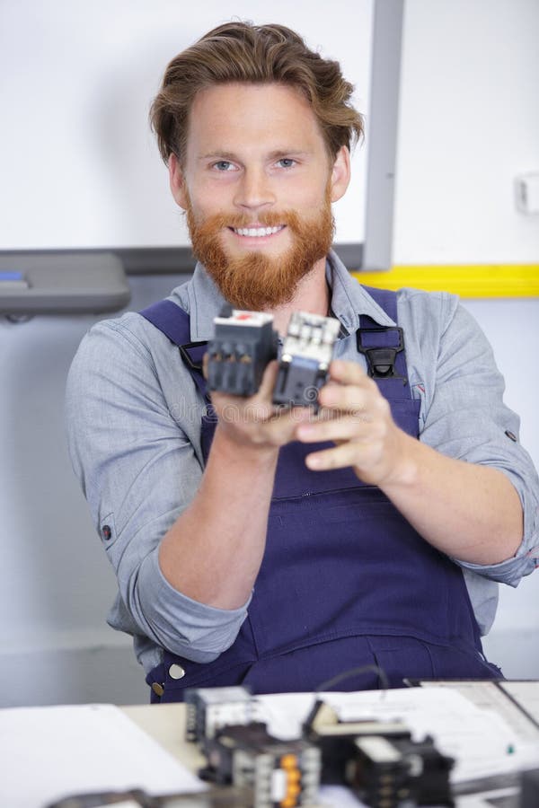 Happy Male Worker with Components in Factory Stock Photo - Image of ...