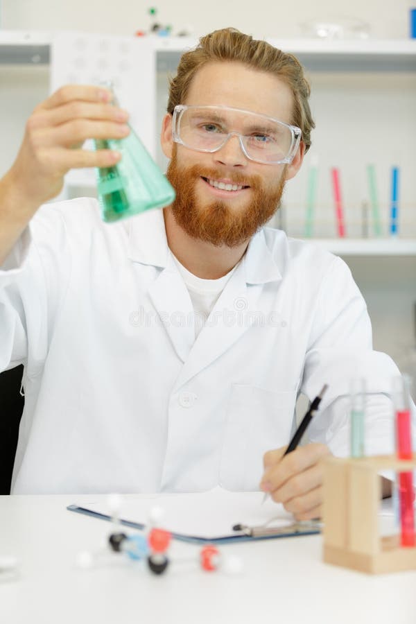 Happy male worker in lab stock photo. Image of sample - 218000950