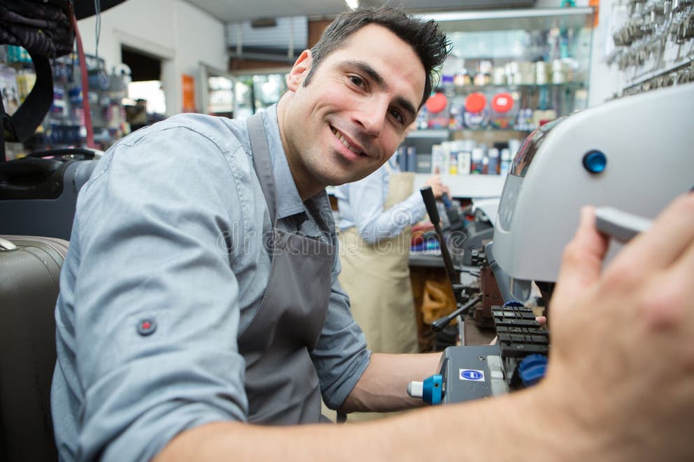 Happy Male Worker Making Keys in Workshop Stock Image - Image of ...