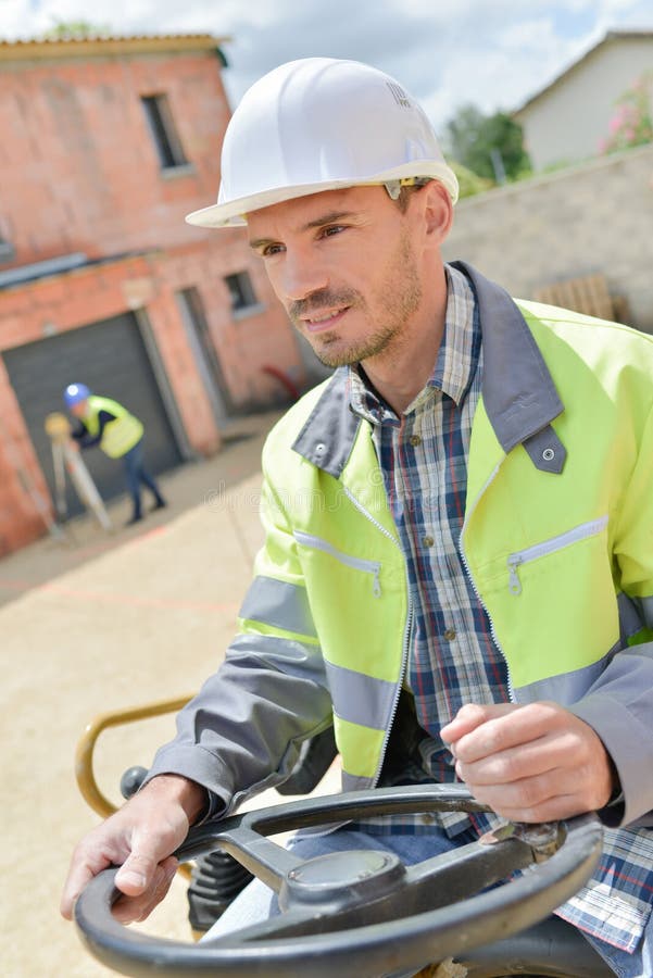 Happy Male Worker Operating Excavator on Construction Site Stock Image ...