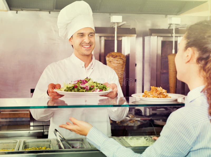 Happy Male Worker Serving Customer With Smile At Shawarma Place Stock ...