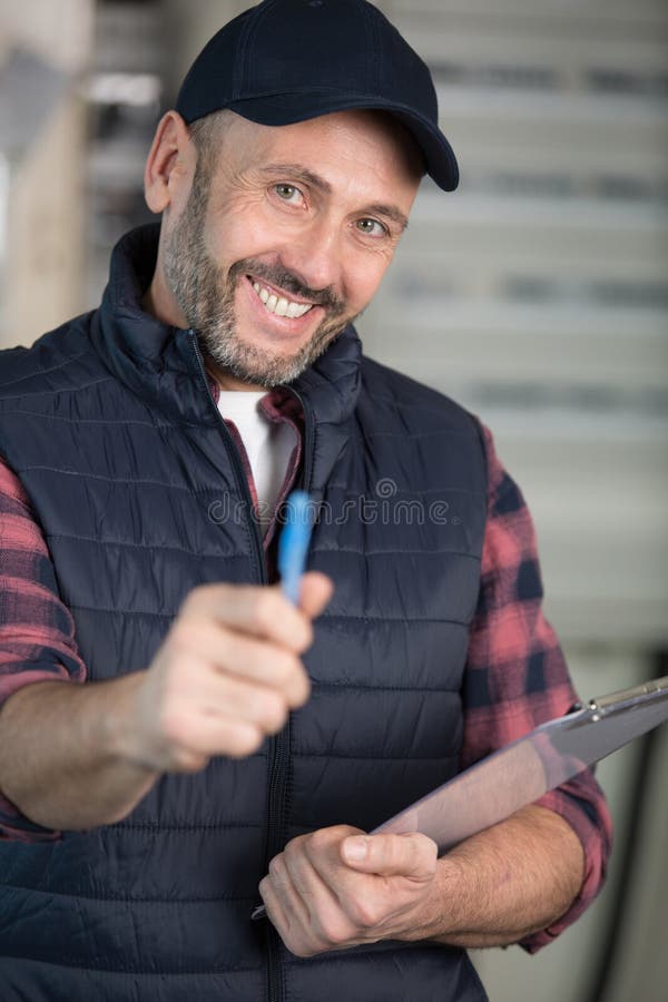 Happy Male Worker Smiling at Camera Stock Photo - Image of engineer ...