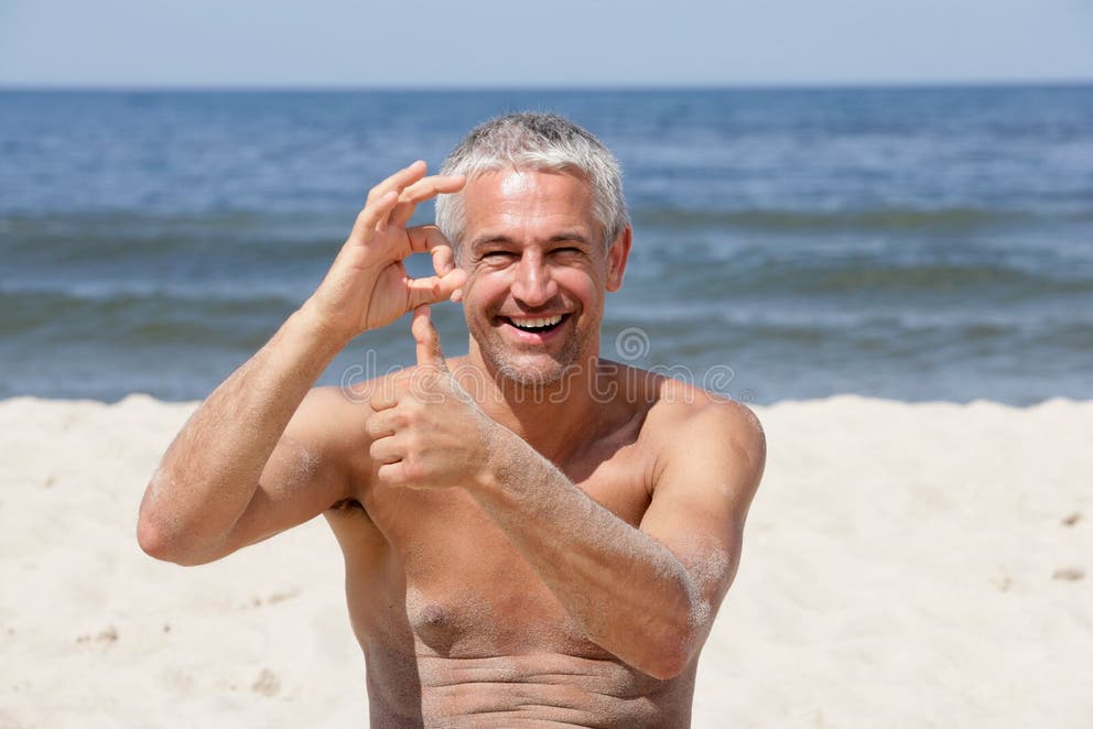 Happy man on beach stock image. Image of indicate, face - 11243397