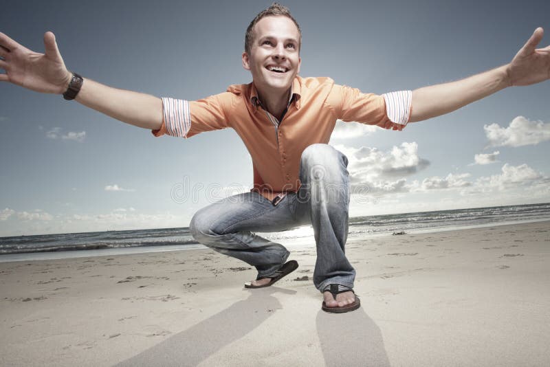 Happy man on the beach stock image. Image of arms, angle - 11714279
