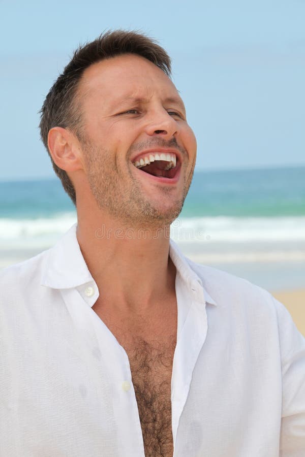 Happy man at the beach stock image. Image of sunny, happy - 15559773