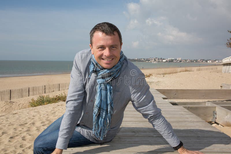 Happy man on the beach stock image. Image of happy, handsome - 61222425