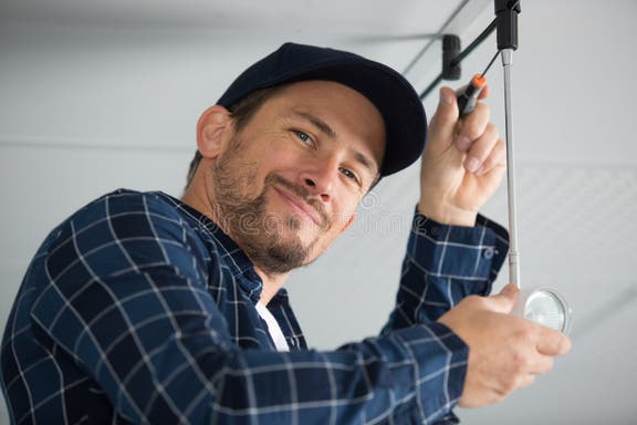 Happy Man in Blue Cap Smiling at Camera Stock Photo - Image of interior ...