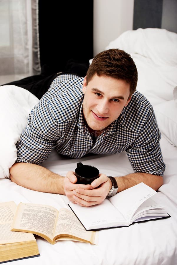 Happy Man with a Book in His Bed. Stock Image - Image of home, lying ...