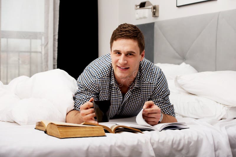 Happy Man with a Book in His Bed. Stock Photo - Image of fatigue, notes ...