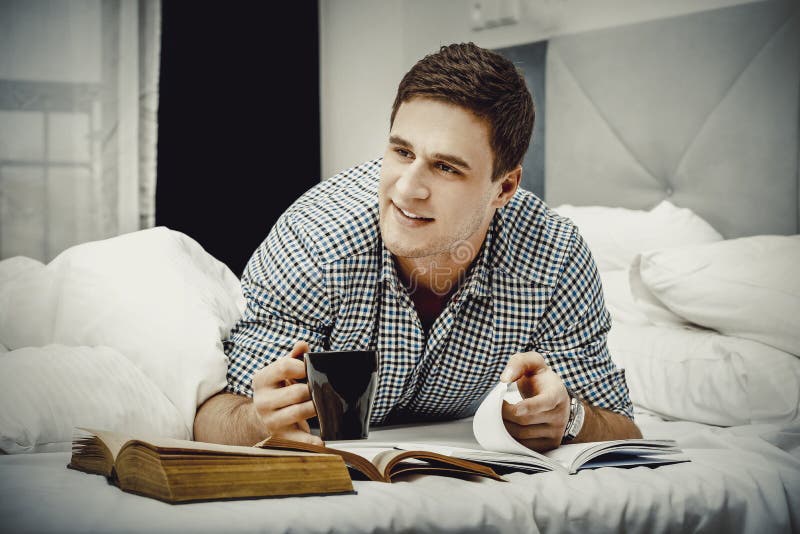 Happy Man with a Book in His Bed. Stock Photo - Image of awake, books ...