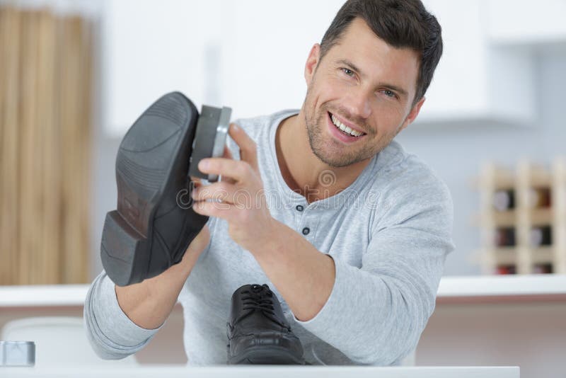 Happy man brushing shoes stock image. Image of clean - 93280747
