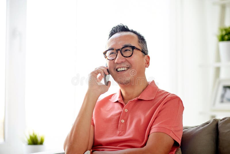 Happy Man Calling on Smartphone at Home Stock Photo - Image of chinese ...