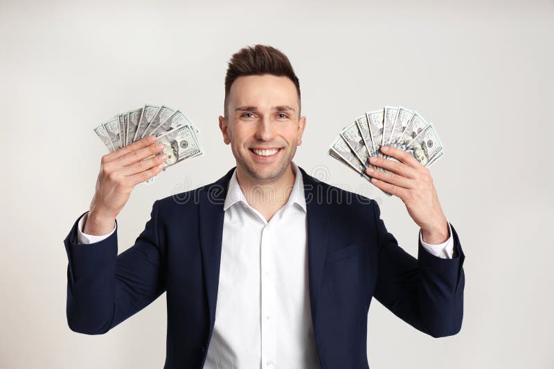 Happy Man with Cash Money on Light Grey Background Stock Photo - Image ...