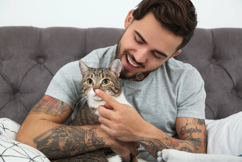 Happy Man with Cat on Bed. Friendly Pet Stock Image - Image of embrace ...