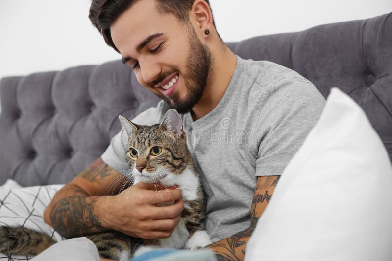 Happy Man with Cat on Bed. Friendly Pet Stock Image - Image of healthy ...