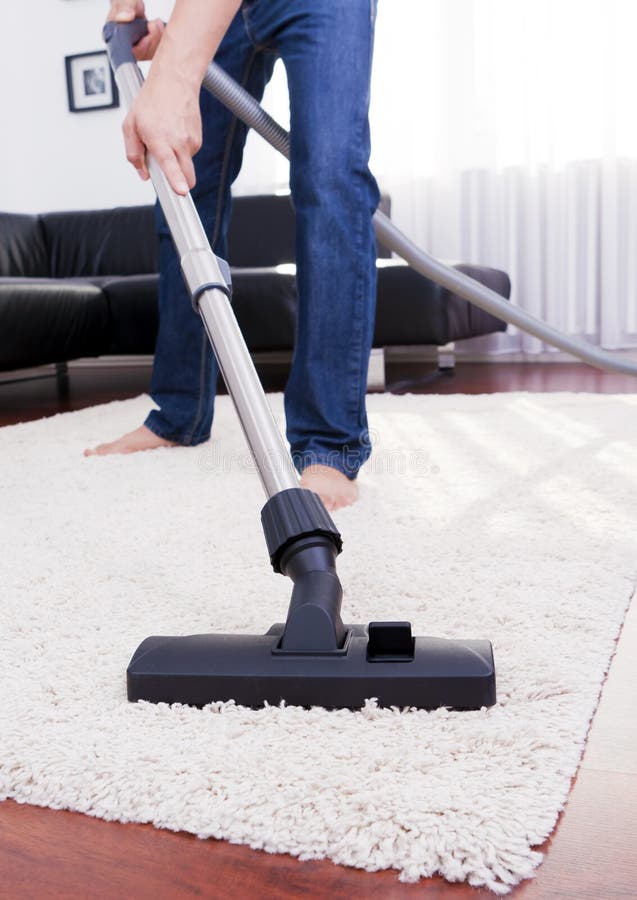 Happy Man is Cleaning in the Modern Room with Vacuum. Stock Photo ...