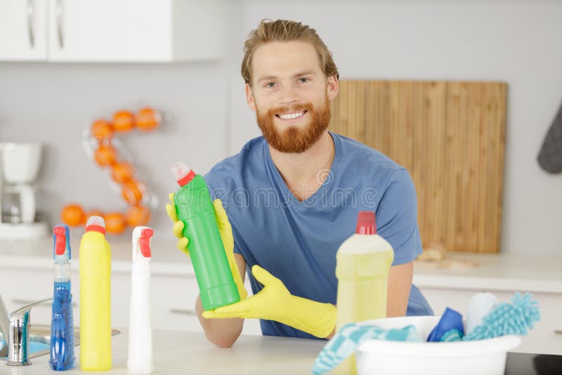 Happy Man Cleans with Cleaning Products Stock Image - Image of ...