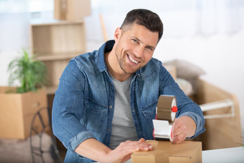 Happy Man Closing Boxes with Duct Tape Stock Photo - Image of home ...