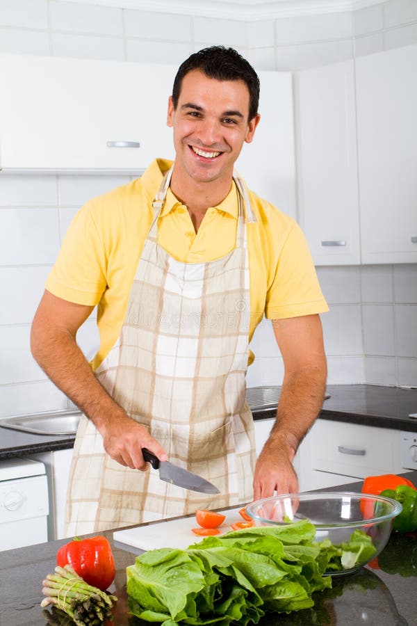 Happy man cooking stock image. Image of green, healthy - 12821159