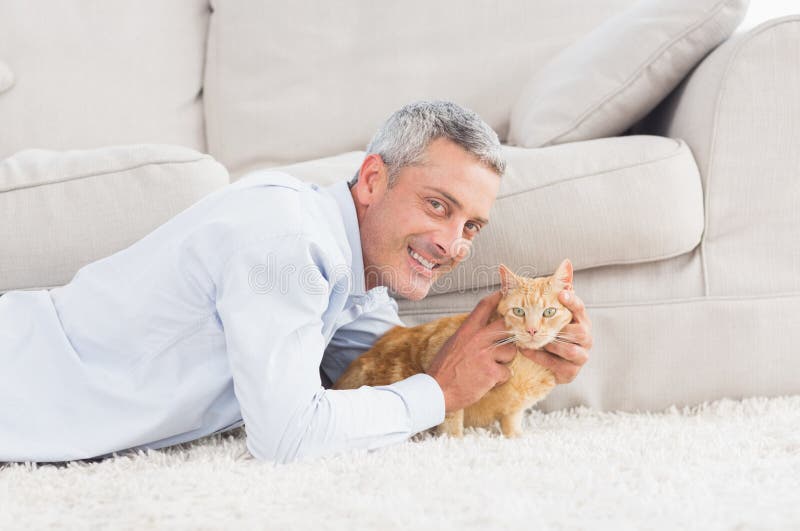 Happy Man with Dog Lying on Rug Stock Image - Image of home, domestic ...