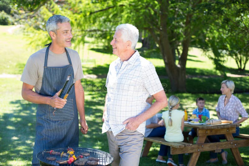 Happy Man Doing Barbecue with His Father Stock Image - Image of ...