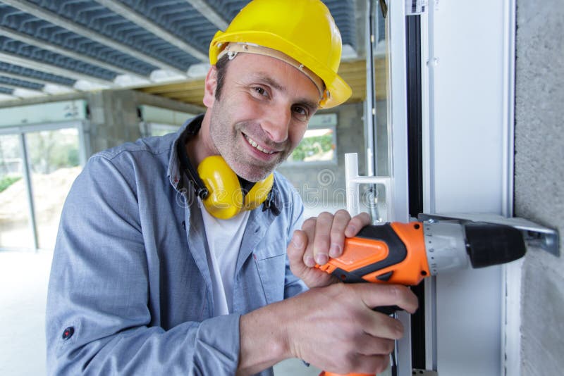 Happy Man Drill at Construction Site Stock Image - Image of light ...