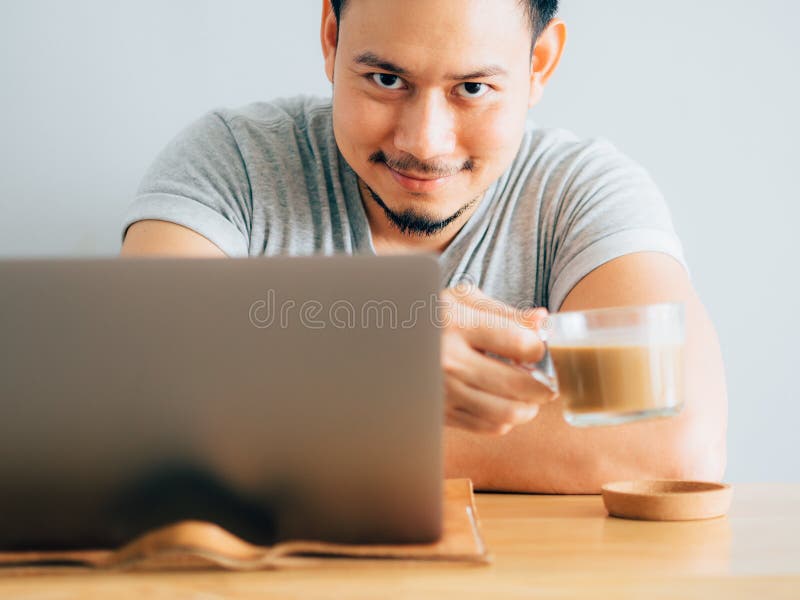 Happy Man Drink Coffee while Use Laptop. Stock Photo - Image of online ...