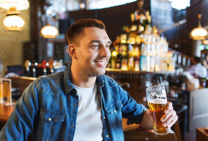 Happy Man Drinking Beer at Bar or Pub Stock Photo - Image of drinking ...