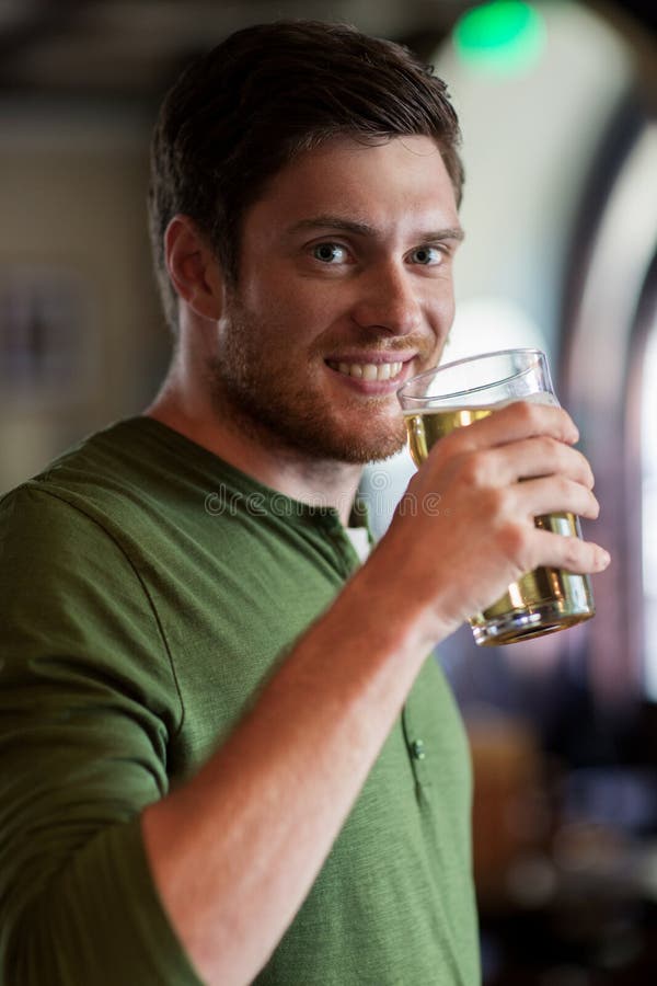 Happy Man Drinking Beer at Bar or Pub Stock Image - Image of light ...