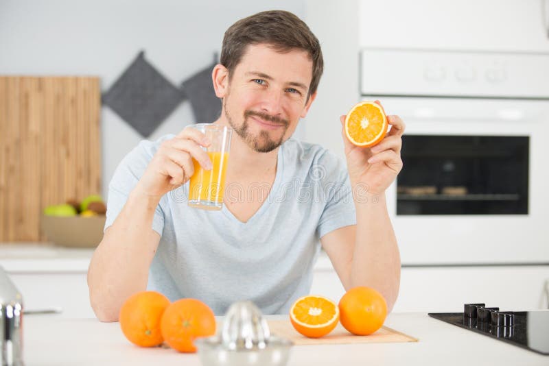 Happy Man Drinking Orange Juice Stock Photo - Image of male, healthy ...