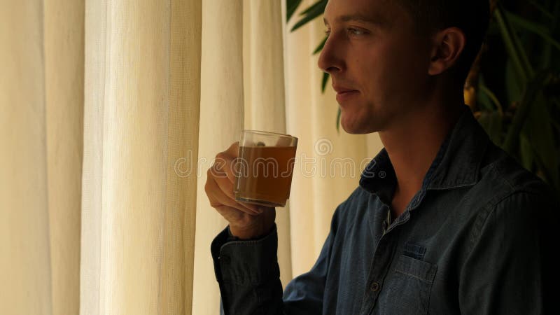 Happy Man Drinking Tea by the Window Stock Image - Image of light ...