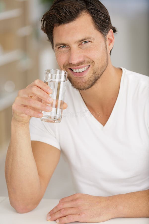 Happy Man Drinking Water in Kitchen Stock Photo - Image of inside ...