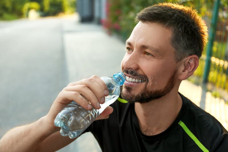 Happy Man Drinking Water Outdoors on Hot Summer Day. Refreshing Drink ...