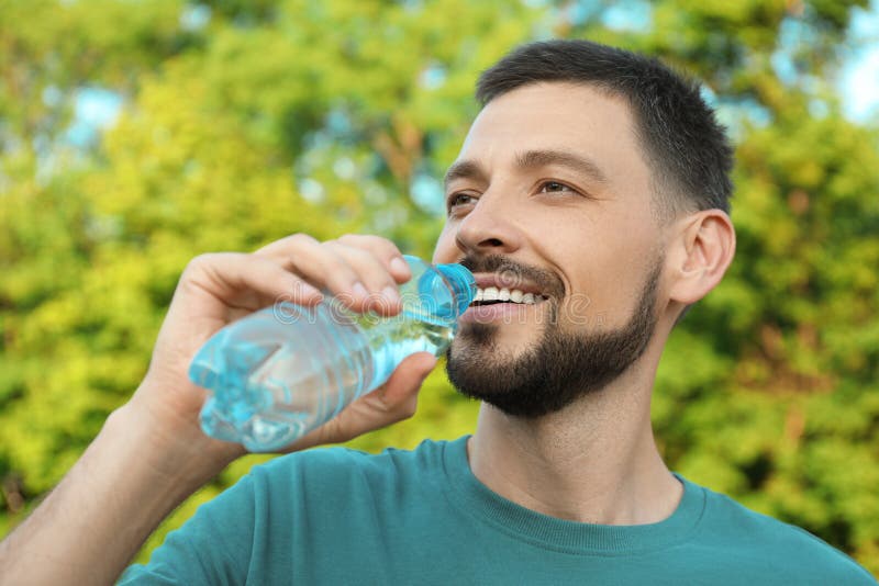 Happy Man Drinking Water Outdoors on Hot Summer Day. Refreshing Drink ...