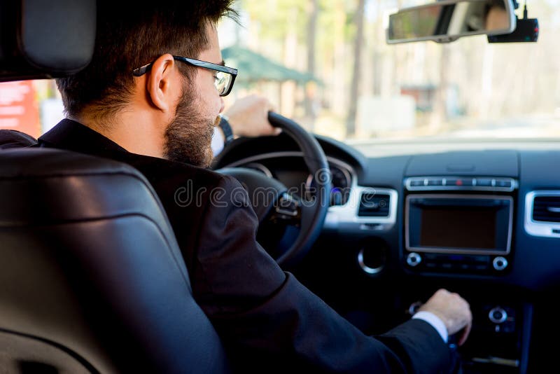 Happy man driving a car stock photo. Image of motor, road - 94684044