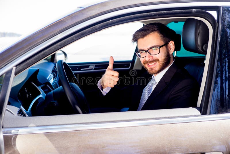 Happy man driving a car stock image. Image of selling - 94684305