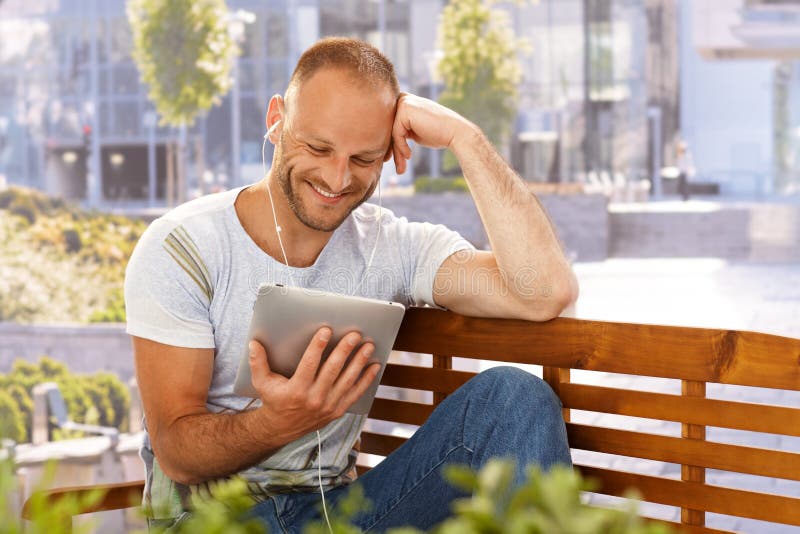 Smiling Guy Using Laptop Computer Stock Photo - Image of adult, indoors ...