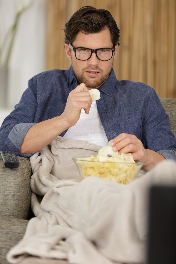 Happy Man Eating Popcorn and Watching Tv at Home Stock Image - Image of ...