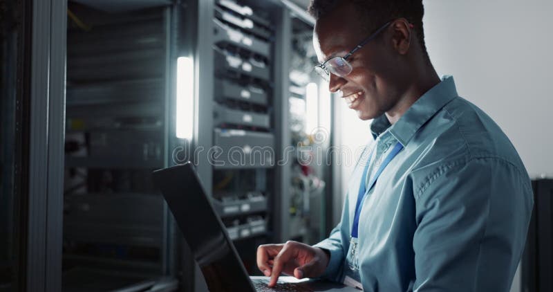 Happy Man, Engineer and Laptop in Server Room for Database Update ...