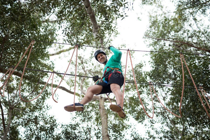 Man Enjoying Zip Line Adventure in Park Stock Photo - Image of danger ...